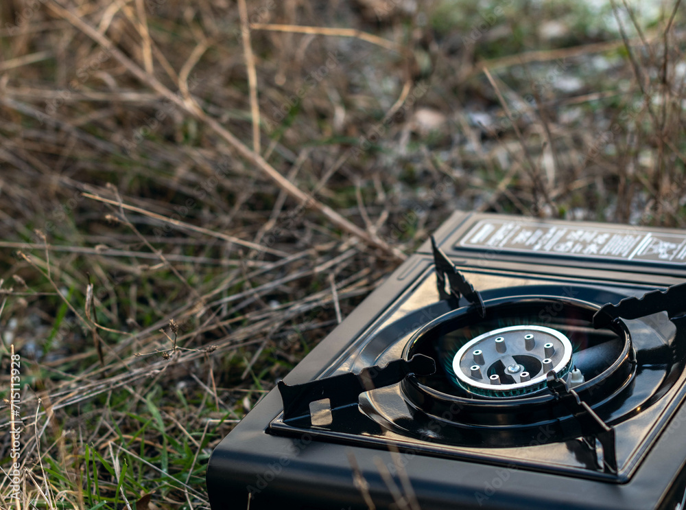 Camping gas stove is small, individual traveler lights a camp stove ...