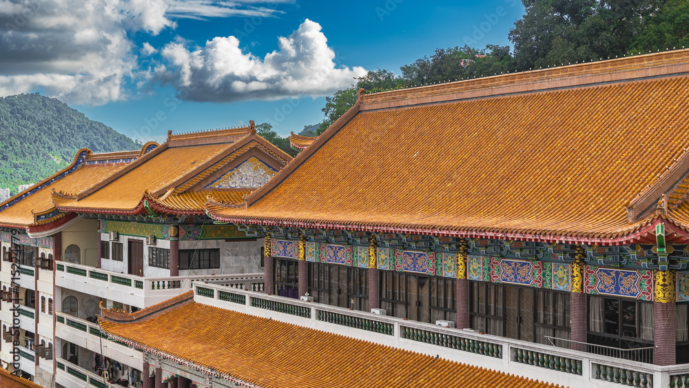 The tiled roofs of Chinese houses are elegantly curved and decorated ...