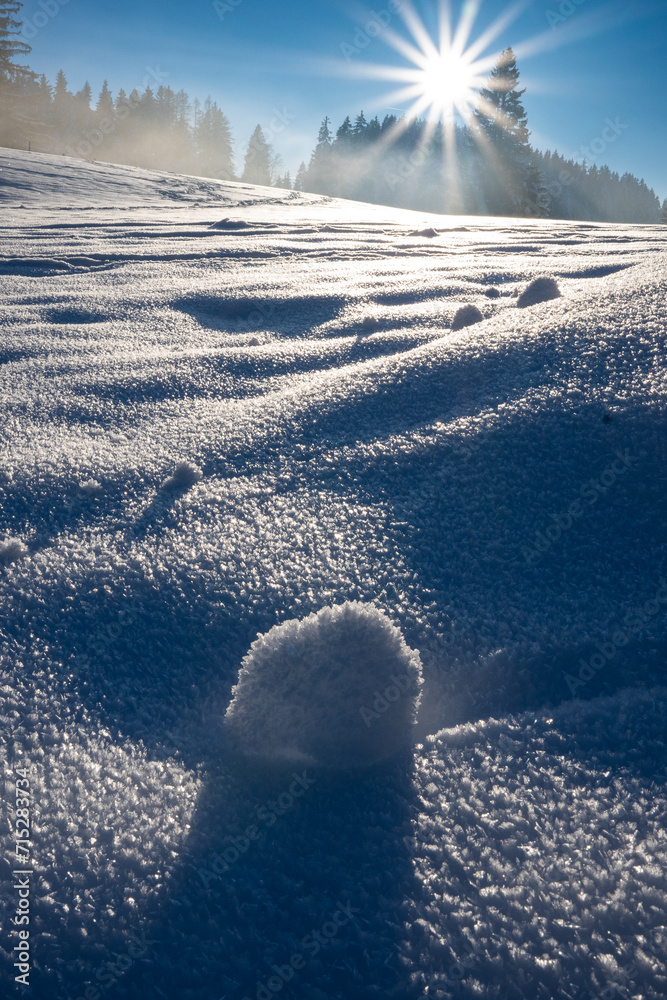 Snow covered landforms. Ice crystals and a natural snowball in the ...