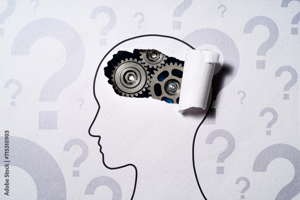 Thinking about problems and questions. Human head silhouette and gears ...