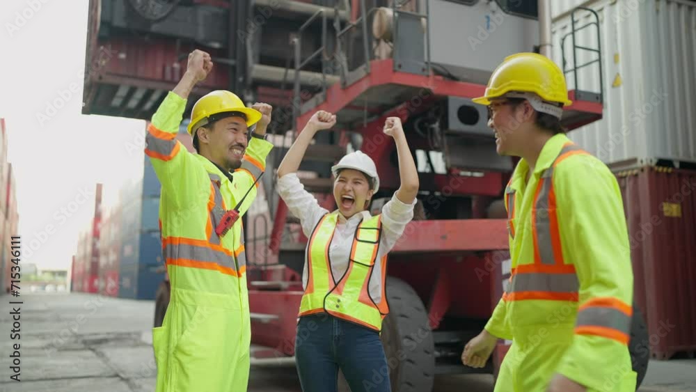 Team of warehouse industrial workers stack hands or join hand teamwork ...