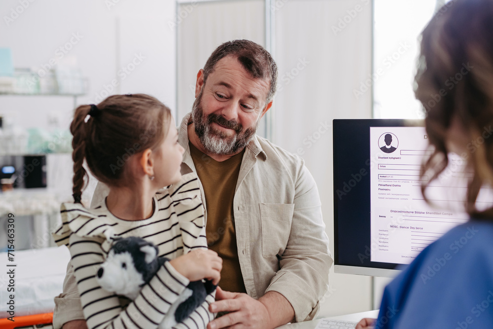 Doctor explaining test results to father of young girl patient. Concept ...