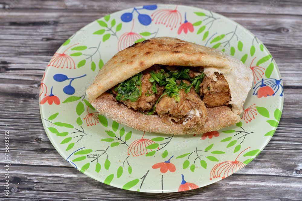 Cow beef brain covered with flour and fried in deep hot oil, a sandwich ...