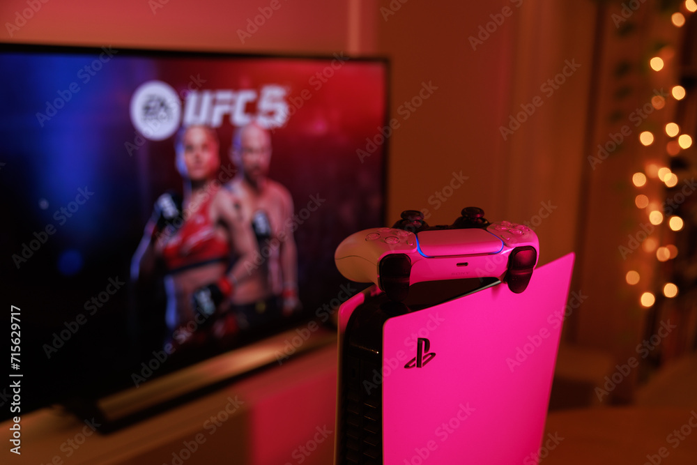 New UFC 5 Sony PS5 console. Dualsense controller. Man holding joystick ...