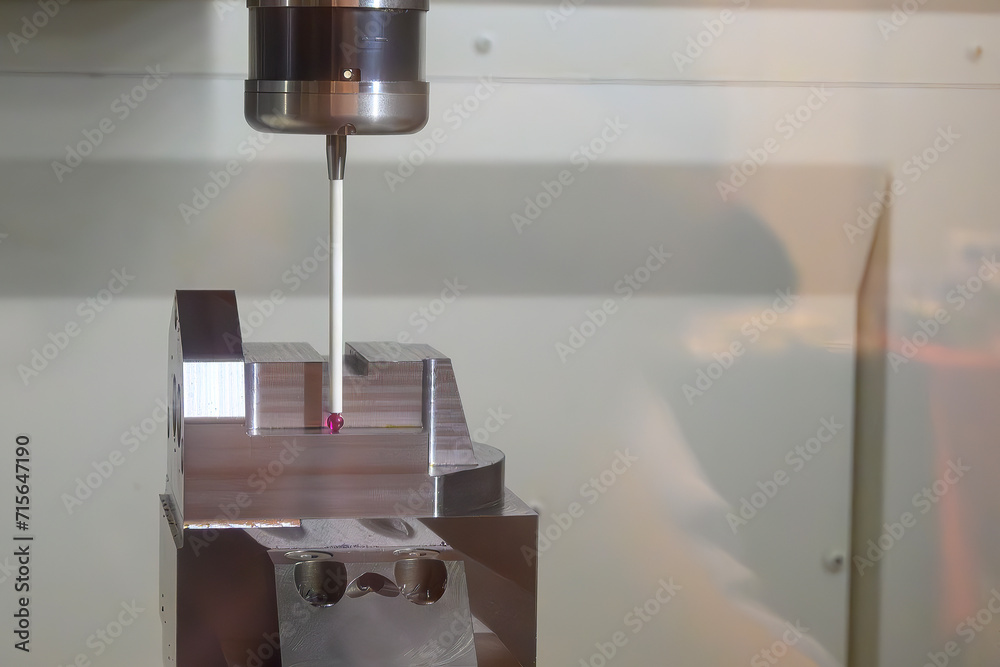 The CMM probe measuring the mold parts on machining center. The quality ...