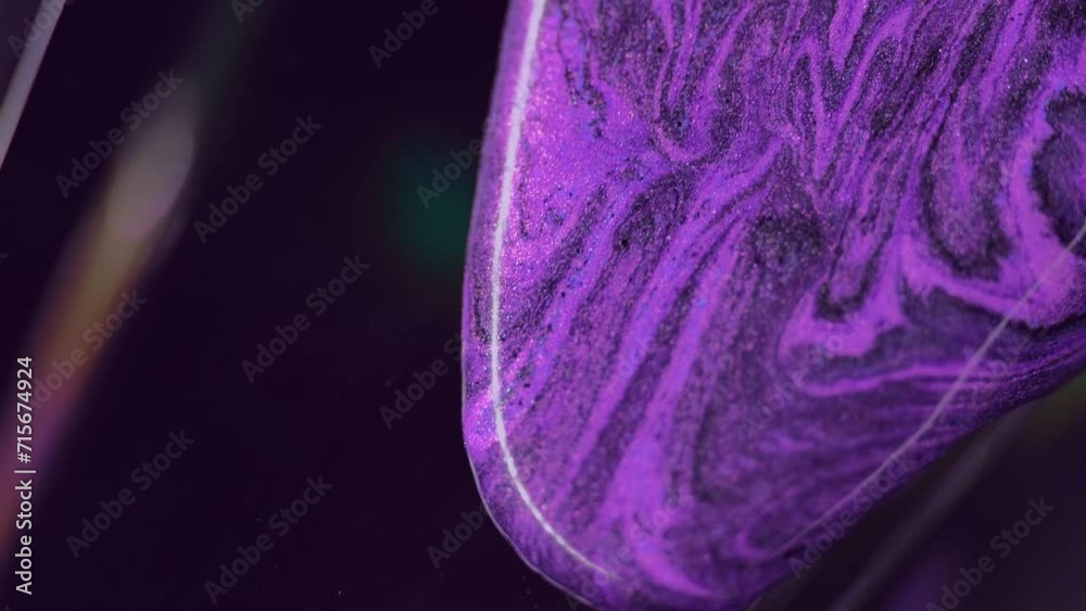 Paint spill. Glitter fluid flow. Defocused neon purple color shiny ...