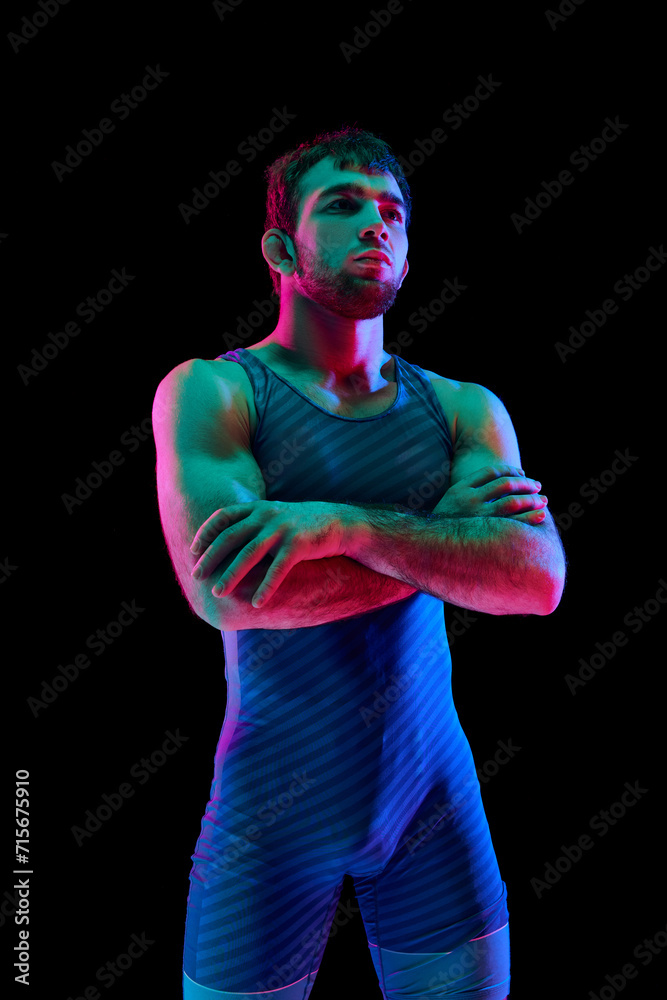Young athlete man, Greco-Roman fighter in sportwear posing against ...