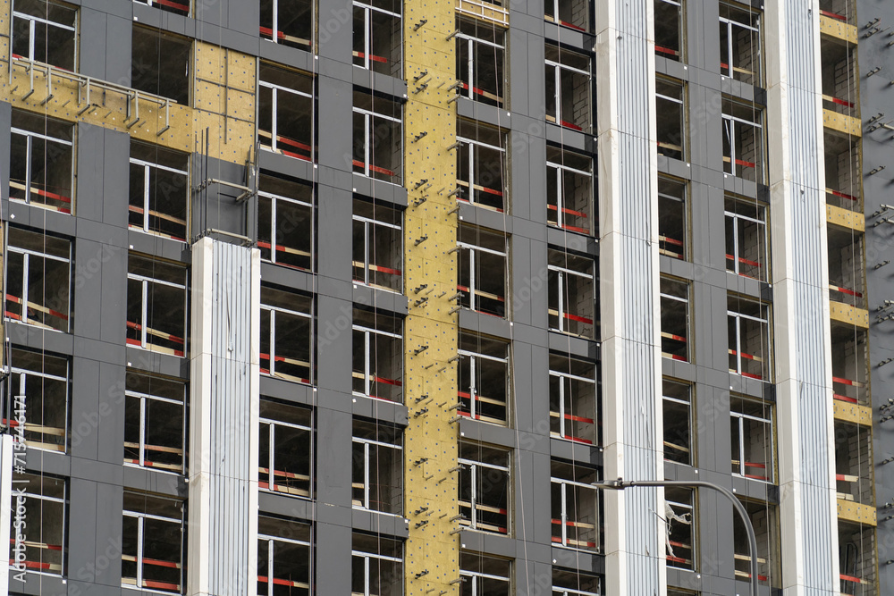 Installation of external wall thermal insulation with rock wool ...