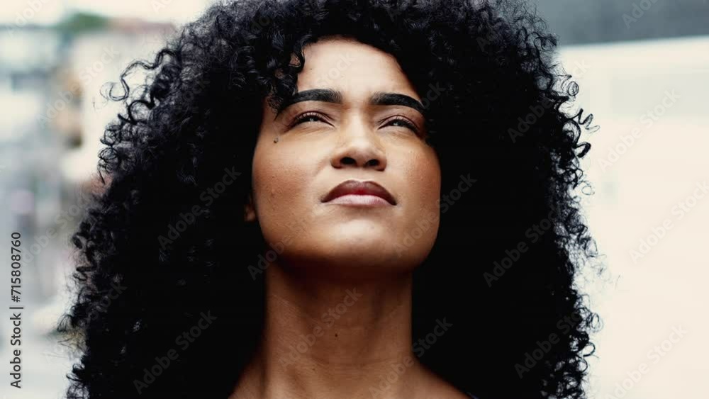 Young Spiritual African American woman looking up at sky BELIEVING and ...
