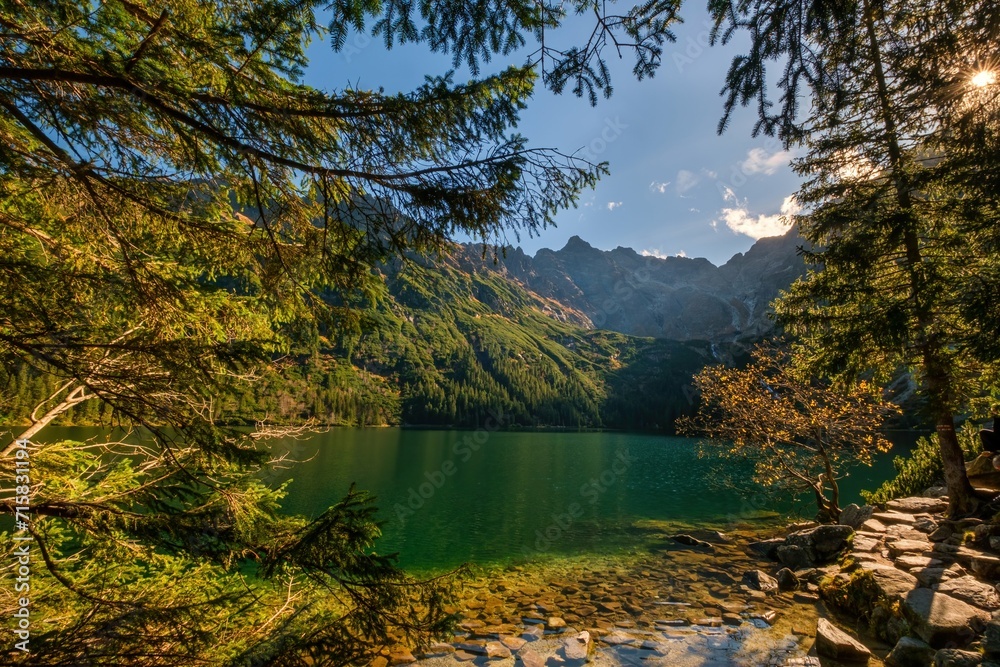 Beautiful, colorful mountain lake with an azure surface and mountain ...