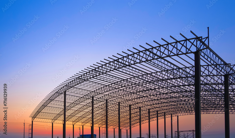 Silhouette of curve metal roof beam framework and columns of large ...