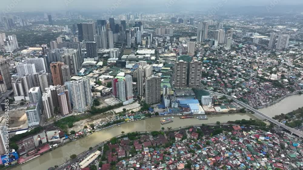 Vidéo Stock Manila cityscape at river banks aerial. Downtown area with ...