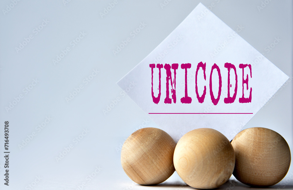 UNICODE - word on a white piece of paper on a white background with wooden balls Stock Photo ...