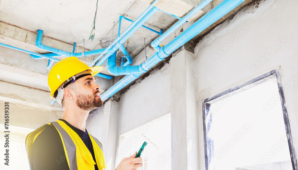 Supervisor caucasian male plumber worker holding wrench inspecting work ...
