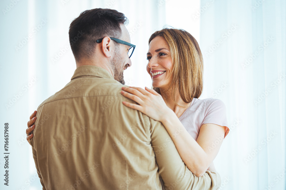 Two people in big love, hugging each other. Happy couple in their new ...