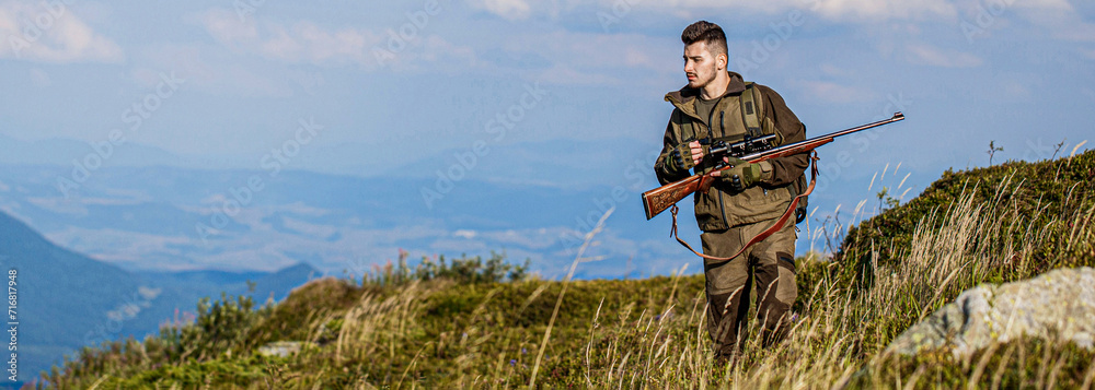 Hunter man. Hunting period. Hunter is aiming. The man is on the hunt ...