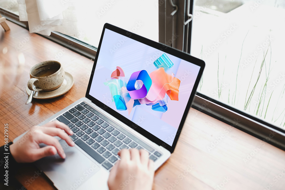 Bangkok. Thailand. JAN 24,2024 :A man useing laptop computer displaying ...