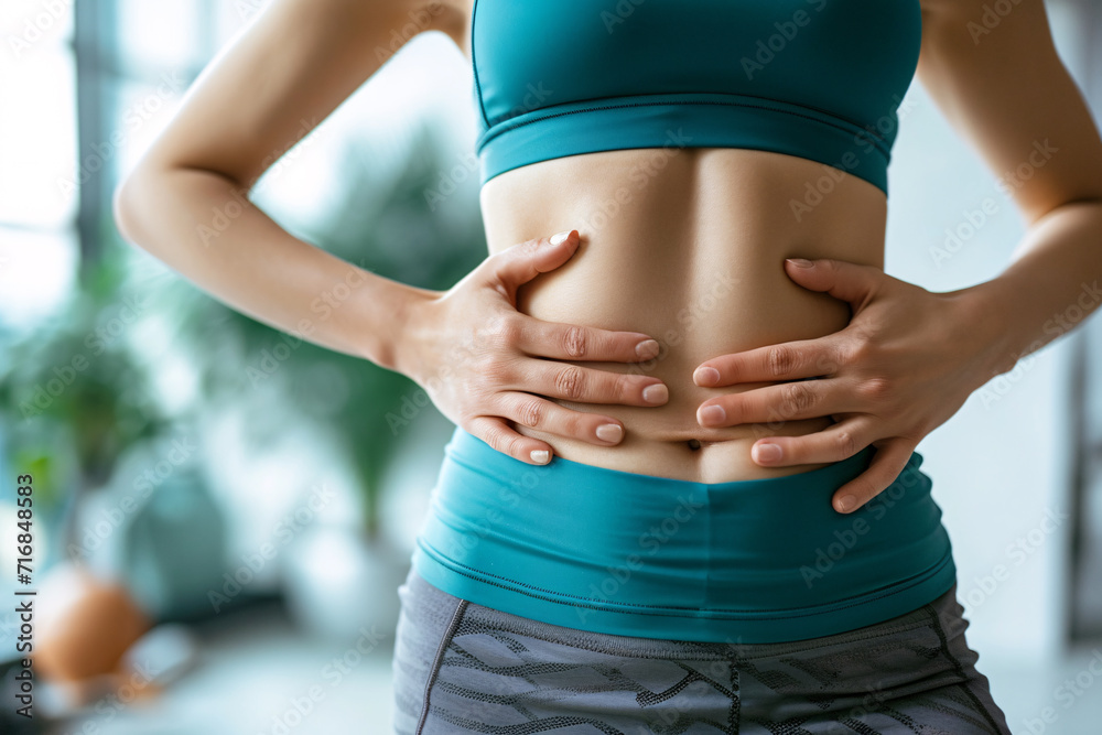 Gastrointestinal complaints concept, a woman holding her stomach ...