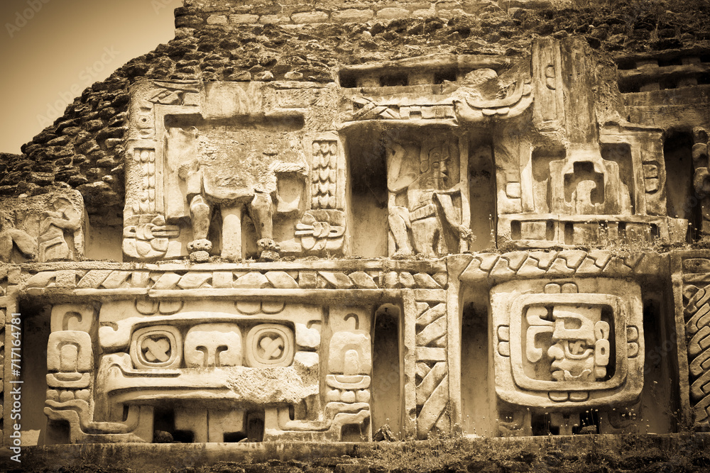 Sepia Tone Mayan ruins and stone carvings at the XUNANTINICH (Stone ...