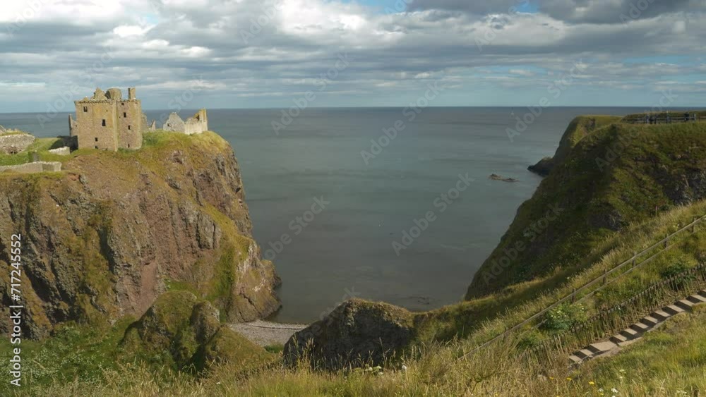 Panoramic view with ruins of Dunnottar Castle on rocky headland by the ...