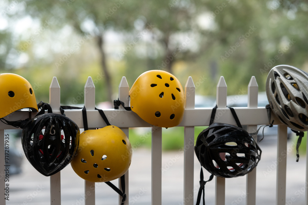 Multiple bicycle headgear protection, yellow, black and grey colored ...