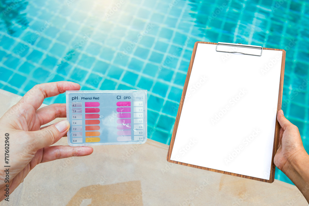 Girl hand holding water testing test kit with blank report sheet in ...