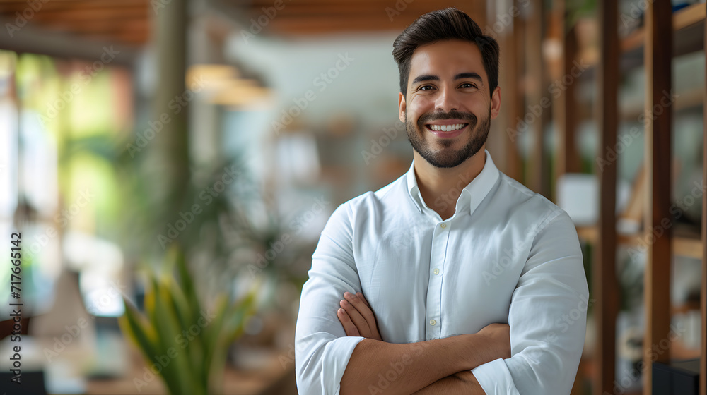 Arms crossed, a confident, wealthy, and cheerful young Latin ...