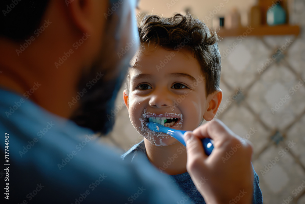 Father and son brush their teeth in the bathroom. Father teaches child ...