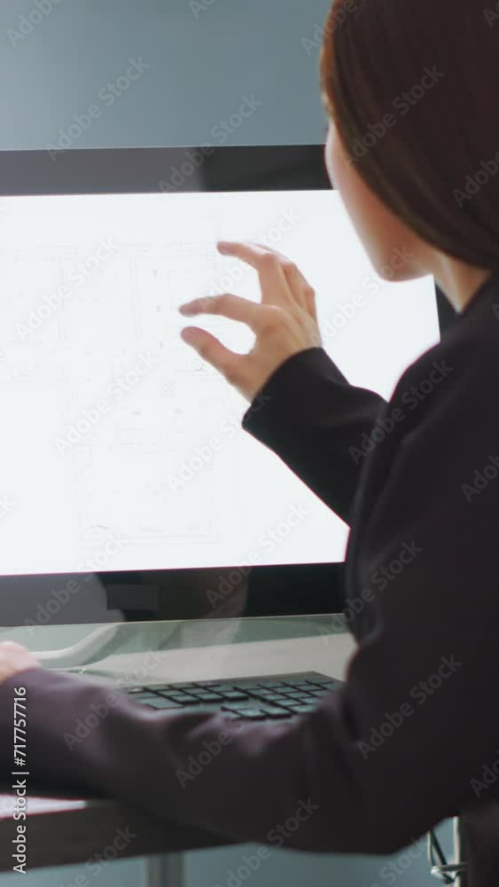 Vertical Video Architect designing blueprints for house remodeling ...