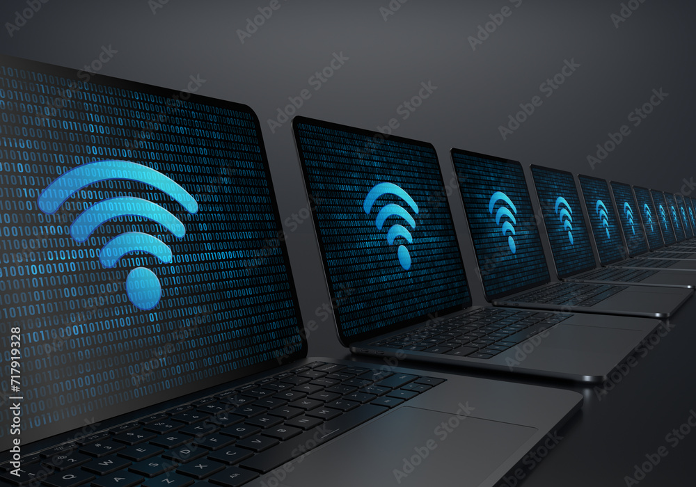 Laptop devices lined up diagonally with Wi-Fi internet icon on their ...