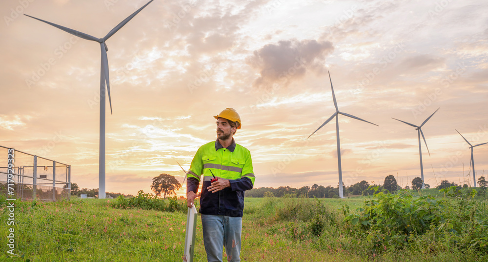 Engineer wearing uniform inspection and survey work in wind turbine ...