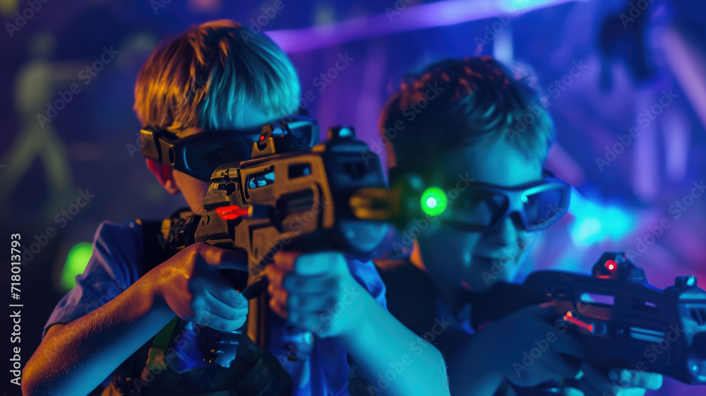 cheerful children playing laser tag, kids, shooting, laser gun, game ...