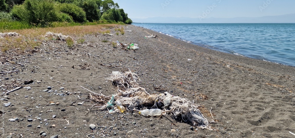 plastic pollution in lake Sevan, Armenia, plastic bottles on beach, old ...