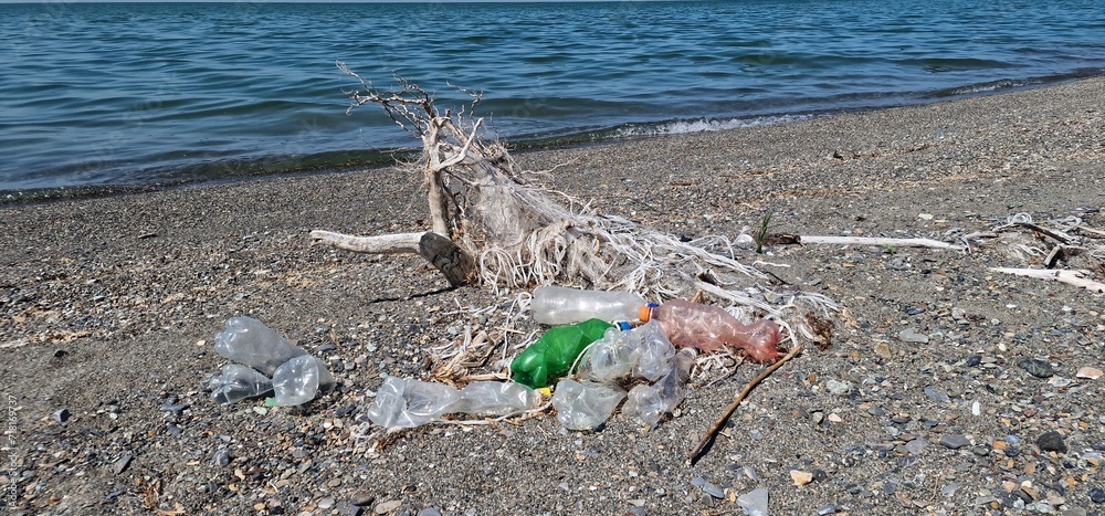 plastic pollution in lake Sevan, Armenia, plastic bottles on beach, old ...