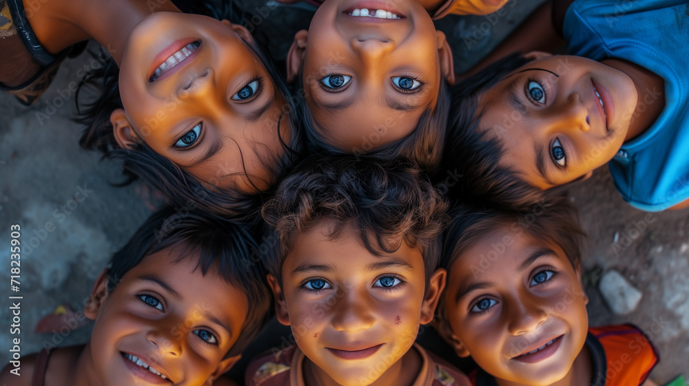 kids looking in to the camera above.Rare view kids looking in to the ...