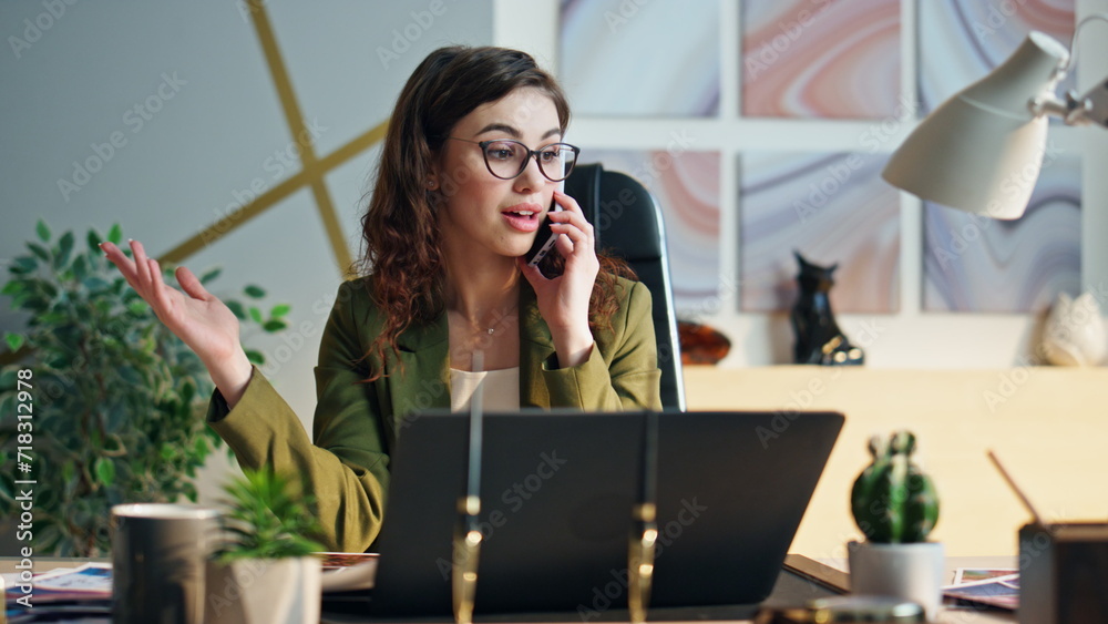 Girl employee talking telephone at office desk close up. Woman manager ...