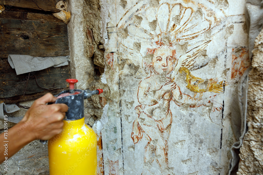 Restorer hand Wet with Water Surface of Baroque Wall Painting for ...
