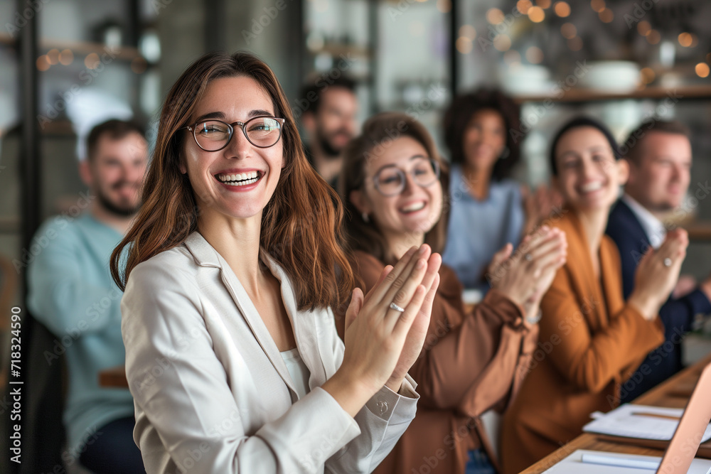 An image capturing the moment of employee recognition with colleagues ...
