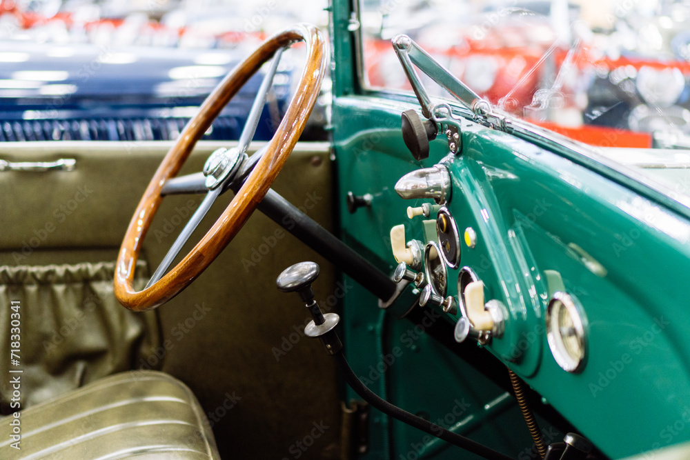Interior of an old BMW car with steering wheel, car controls and ...