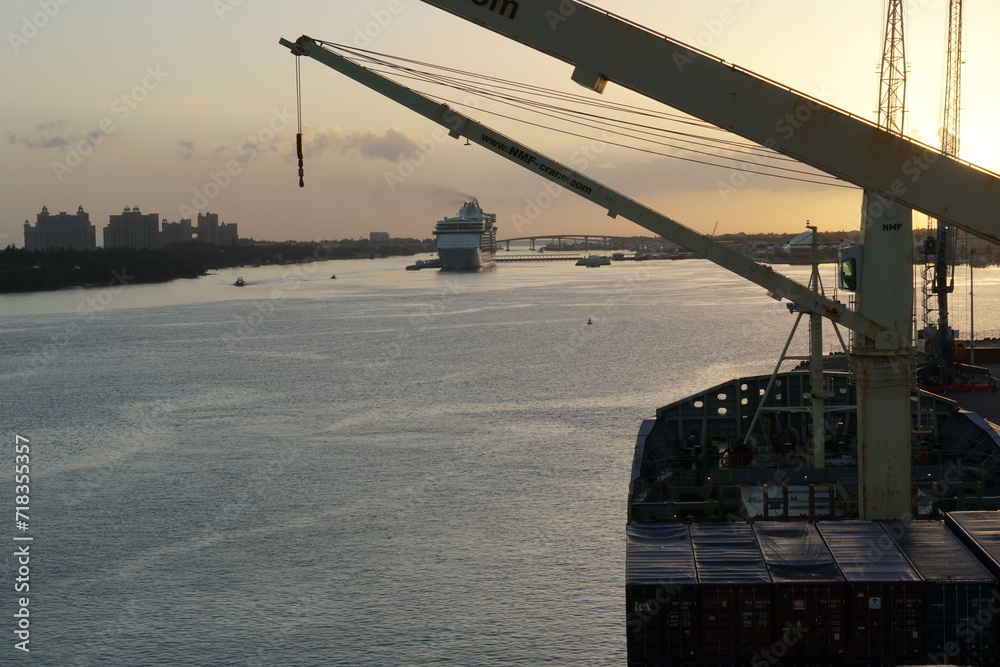 Nassau, Bahamas 12 03 2023: Container vessel equipped with ship cranes ... Nassau, Bahamas 12 03 2023: Container vessel equipped with ship cranes ...