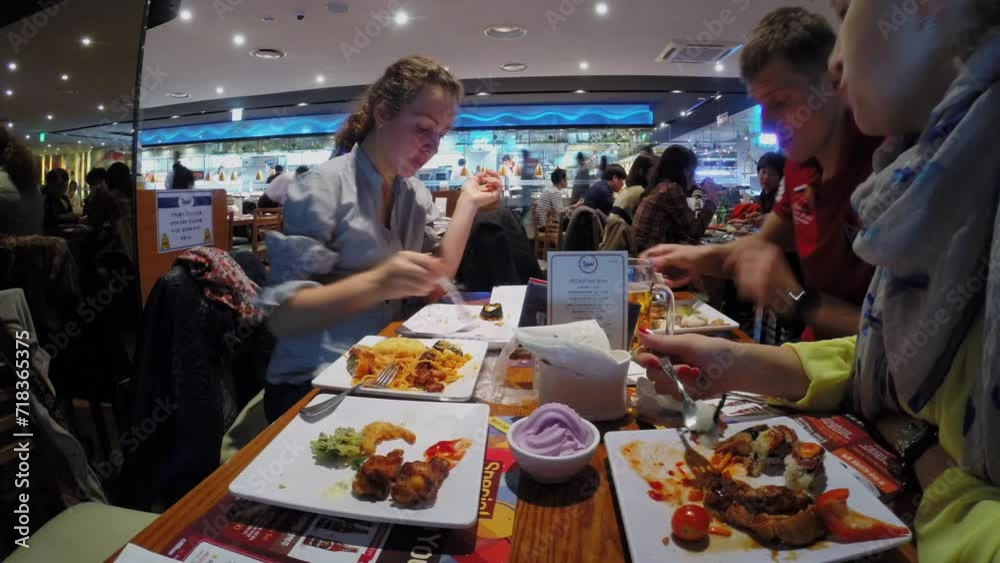 Family pairs eat in fast-food restaurant Todai. Timelapse Stock Video ...