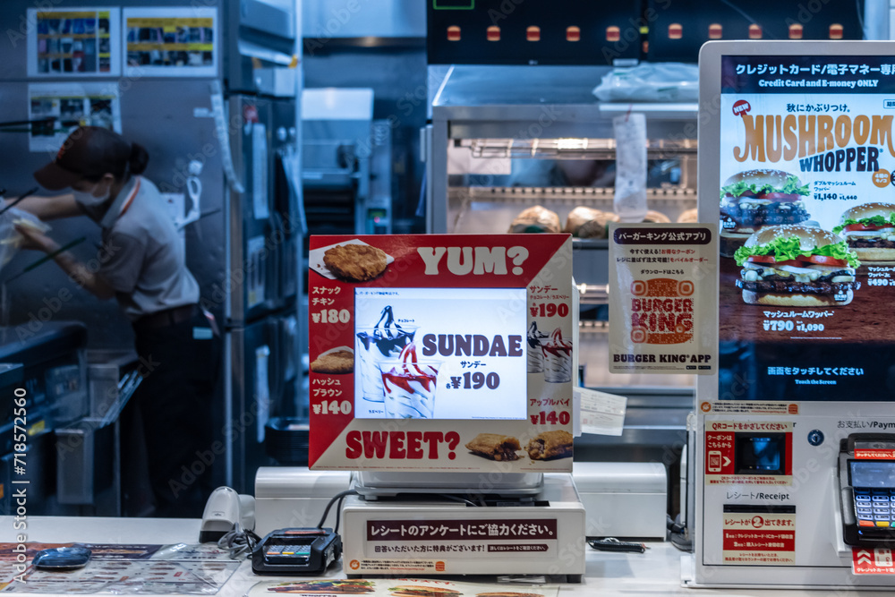 Tokyo, Japan, 31 October 2023: Fast-food restaurant interior with menu ...