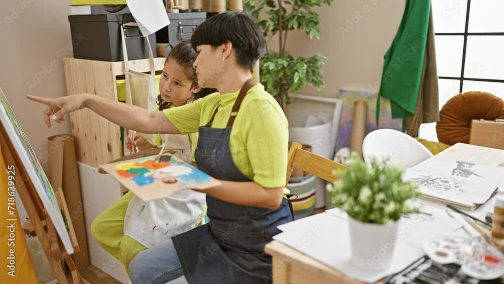 Teacher and student artist bonding as they draw together in art class ...