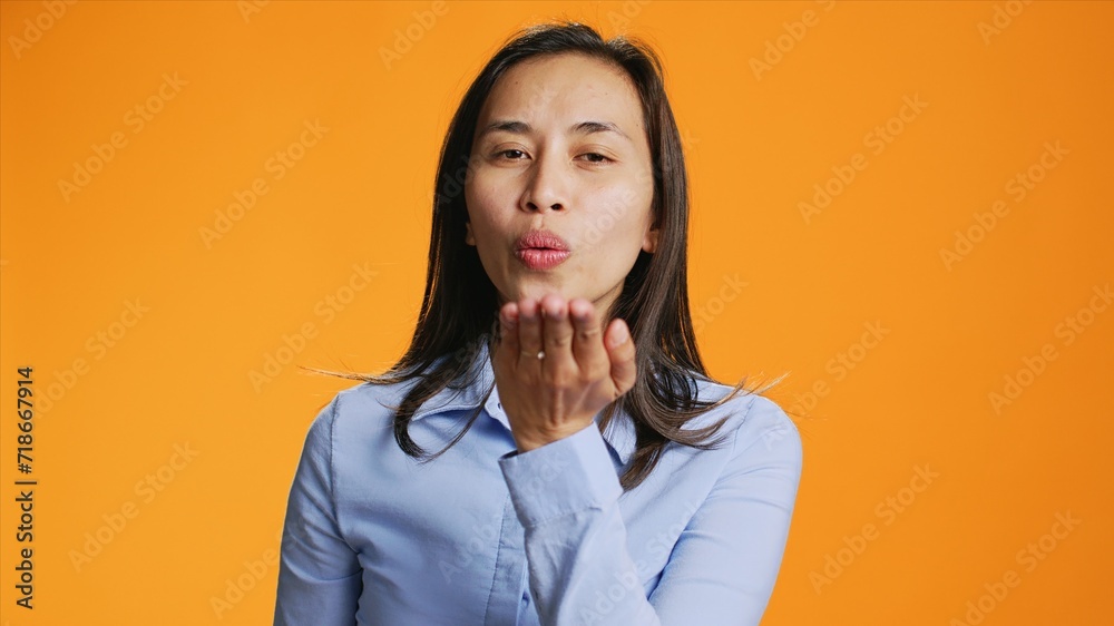 Confident Filipino Person Sending Air Kisses On Camera Expressing Cute
