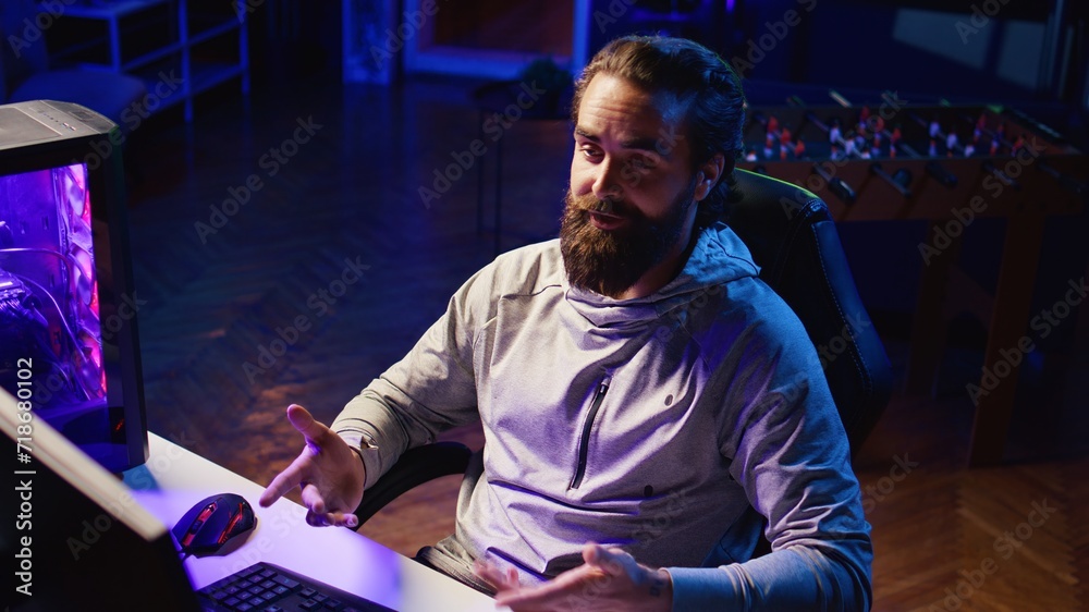 Professional gamer in studio teaching subscribers strategies to beat ...