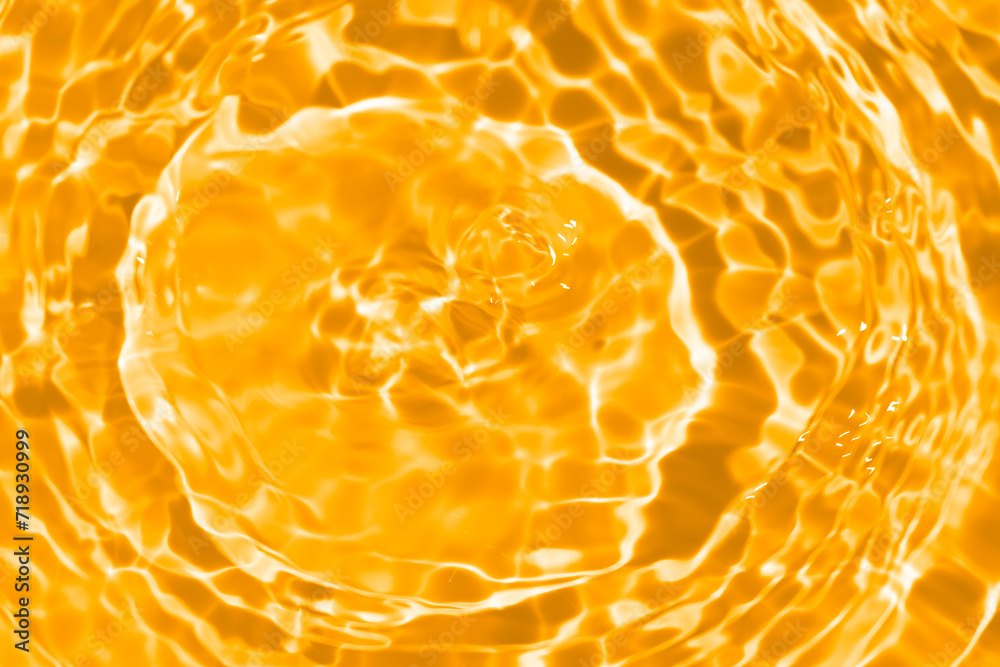 Gold water waves on the surface ripple blurred. Defocus blurred ...