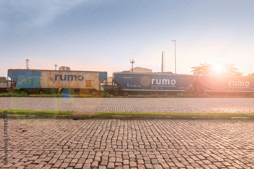 Cargo train of Rumo Company passing through the railroad. Port of ...