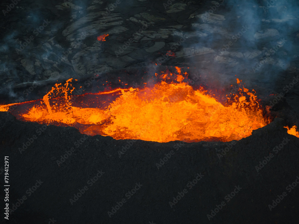 Volcano eruption in Iceland, summit crater, gas expulsion, and molten ...