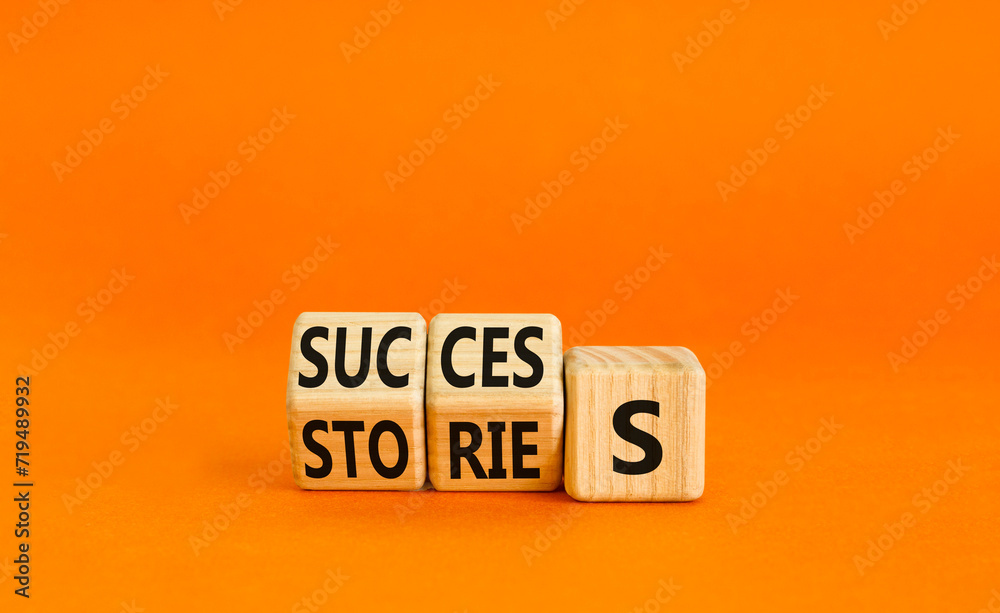 Success stories symbol. Turned wooden cubes and changed the word ...