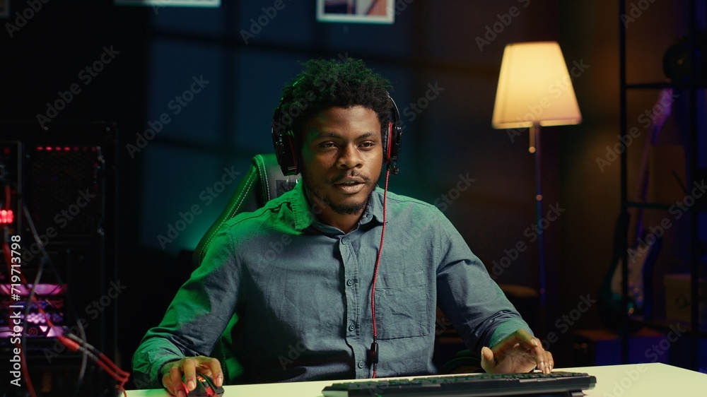 Sad gamer removing headphones in frustration, raging after game over ...